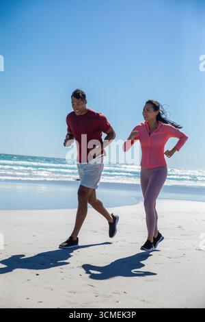 Couple running in nature at morning wearing protective face masks Stock ...
