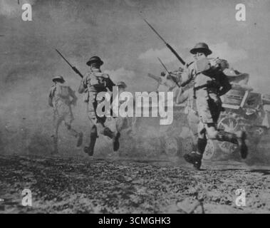 British Eighth Army infantry men run through the dust of the Western ...