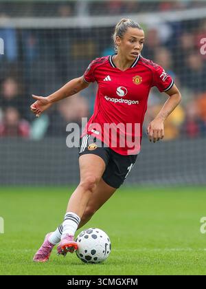 Manchester United's Celin Bizet Ildhusoy (right) has a shot at goal ...