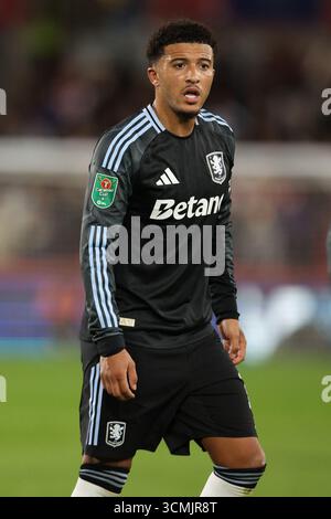 Jadon Sancho of Aston Villa FC dribbles with the ball under pressure ...