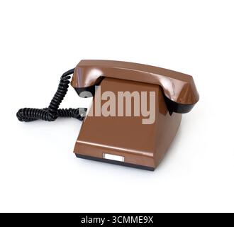 Brown retro push-button telephone, , isolated on a white background ...