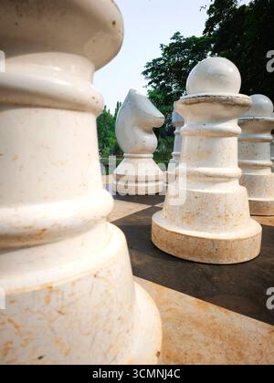 The white pieces of the big outdoor chess set at the park Stock Photo ...