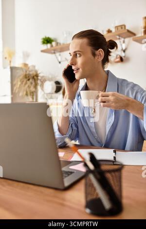 Young man holding figure of art dummy standing over isolated yellow ...