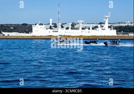 French military motorboats moving near the principal naval base in the ...