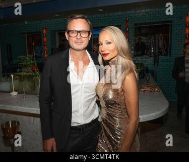 Richard Booth and Indira Cesarine attends the Blue Jacket Fashion Show ...