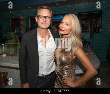 Richard Booth and Indira Cesarine attends the Blue Jacket Fashion Show ...