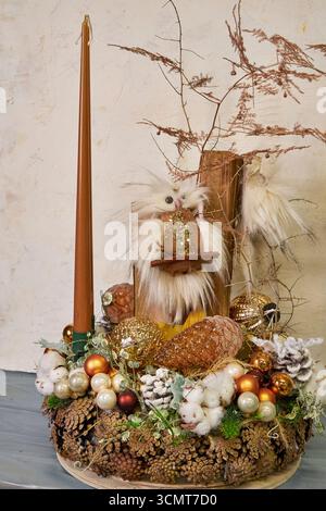 Christmas table arrangement with fir wreath, oranges and candle ...