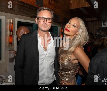 Richard Booth and Indira Cesarine attends the Blue Jacket Fashion Show ...
