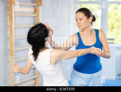 women trained in executing powerful palm punch Stock Photo - Alamy
