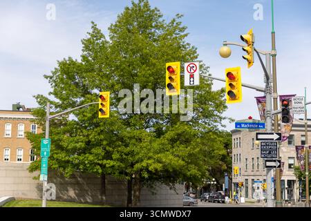 Traffic signs and traffic lights at an intersection; Ottawa, Ontario ...