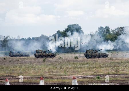 Armored vehicles fire during military exercises of Poland and NATO ...