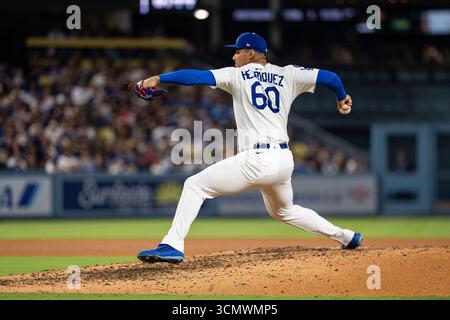 Los Angeles Dodgers pitcher Edgardo Henriquez walks off the field after ...