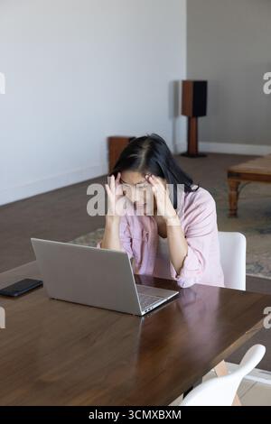 Modern speakers and laptop on wooden table near white brick wall Stock ...