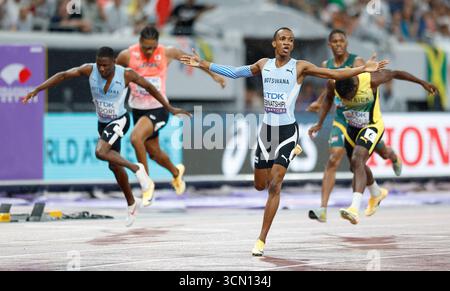 Busang Collen Kebinatshipi (front) of Botswana crosses the finish line ...