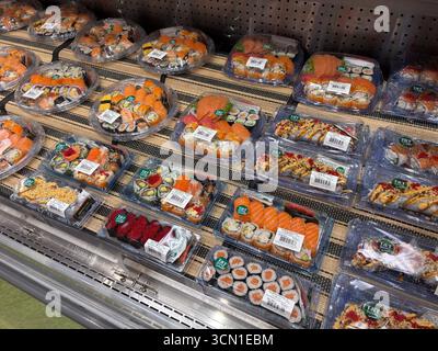 Pre-packaged variety of sushi and sushi rolls in a plastic tray Stock ...