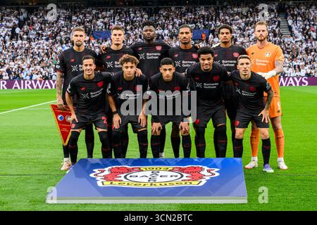 Mark Flekken and Loïc Badé of Bayer 04 Leverkusen celebrate the win ...