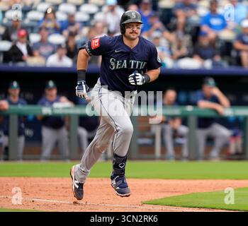 Seattle Mariners' Cal Raleigh runs up the first base line during a ...
