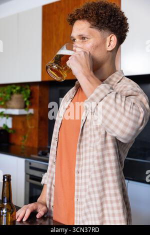 Dark amber glass bottle standing on stone. Natural skin care SPA beauty ...