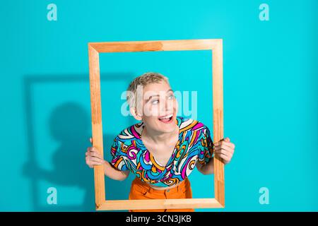 Photo of positive charming blonde short hair woman wear stylish green ...