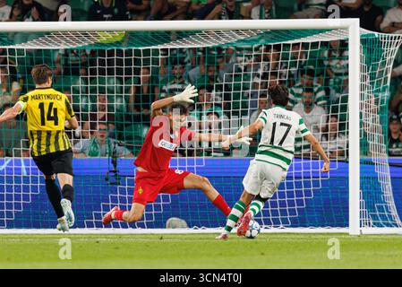 Francisco Trincao of Sporting CP with Sherkhan Kalmurza of FC Kairat ...