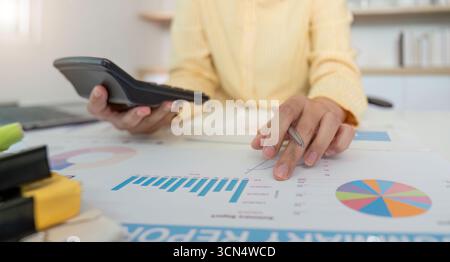 Business professional analyzing financial reports, reviewing ...