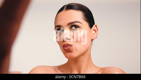 Skincare, selfie and woman with pout, studio and pride for healthy skin ...