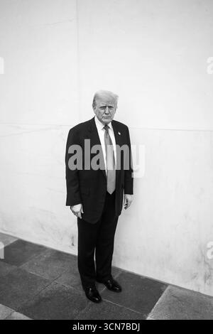 A formal portrait of President Donald J. Trump, showing him in a suit ...