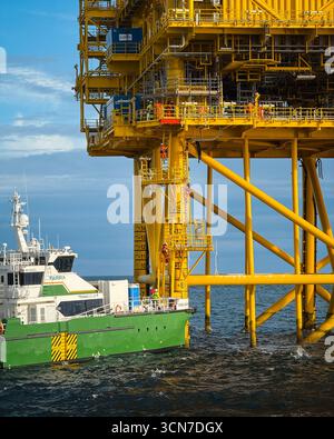 Crew transfer vessel alongside offshore wind substation in the North ...