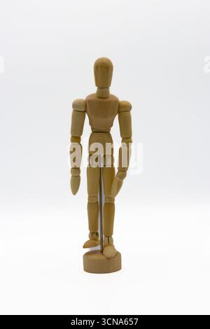 Wooden human model on white background. Mini mannequin Stock Photo - Alamy
