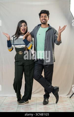 Full body photo of cool young brunette lady hold books jump show v-sign ...