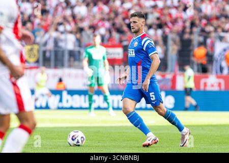Marco Schuster (FC Hansa Rostock, #05) in a duel with Elias Loeder (SSV ...