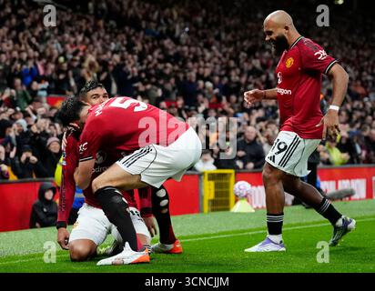 Manchester United's Bryan Mbeumo (right) and Nottingham Forest's Neco ...