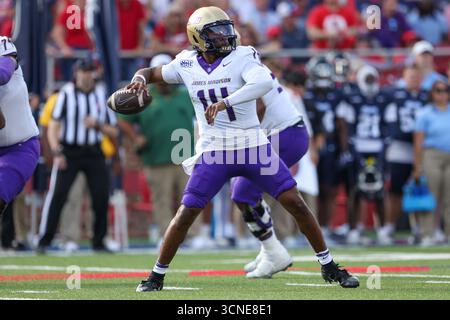 James Madison quarterback Alonza Barnett III (14) throws a pass under ...