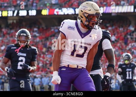 James Madison wide receiver Landon Ellis (13) fights off Louisiana ...