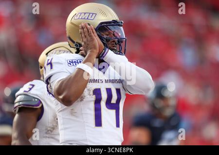 James Madison quarterback Alonza Barnett III (14) carries the ball for ...