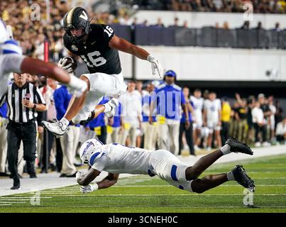 Vanderbilt tight end Cole Spence (16) leaps over LSU linebacker Harold ...