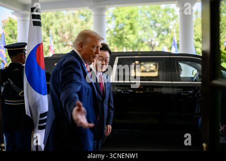 Korean President Lee Jae Myung is welcomed by French President Emmanuel ...