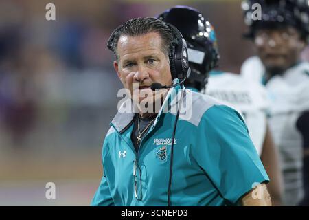 Coastal Carolina head coach Tim Beck, right, argues a call with side ...