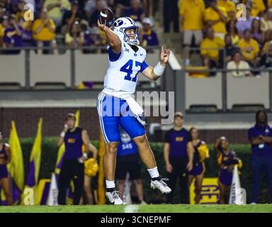 BYU quarterback Bear Bachmeier (47) is hit by Utah safety Tao Johnson ...