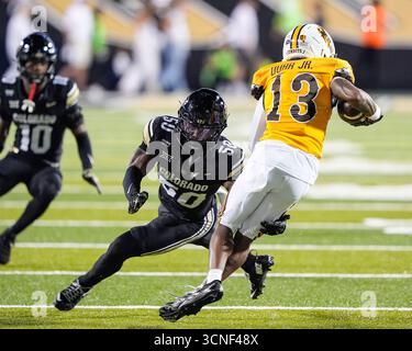 Wyoming wide receiver Chris Durr Jr. (13) is tackled by Colorado ...