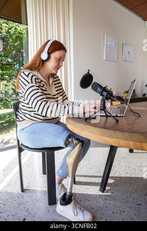 Woman wearing pullover sitting near heater radiator and hugs it Stock ...