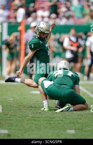South Florida place-kicker Nico Gramatica (7) kicks a field goal as ...