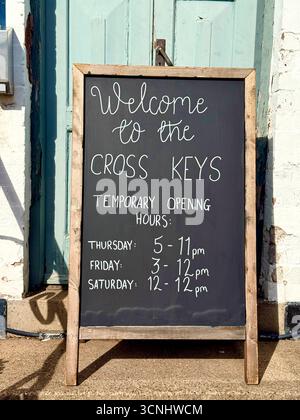 Opening times at a village pub in England U.K Stock Photo - Alamy