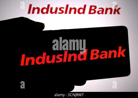 In this photo illustration, an IndusInd Bank logo is seen displayed on ...