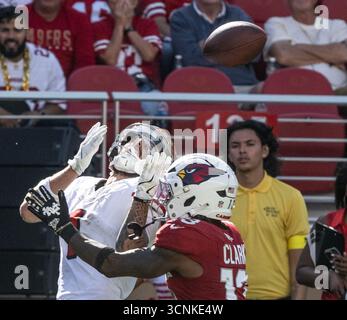 Arizona Cardinals cornerback Kei'Trel Clark (13) leaps onto the field ...
