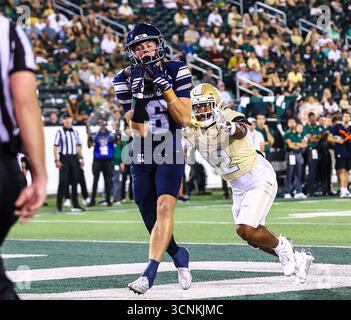Rice wide receiver Drayden Dickmann, left, is hit in the back on the ...
