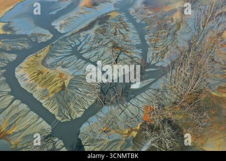 Aerial view of colorful contaminated cyanide residuals waters from gold ...
