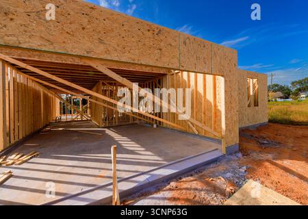 Workers set up wooden frames beams supports to shed at construction ...