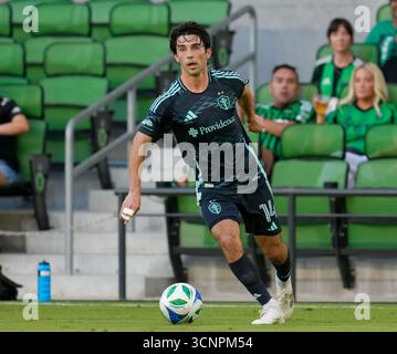 Seattle Sounders FC forward Paul Rothrock, center, attempts a bicycle ...