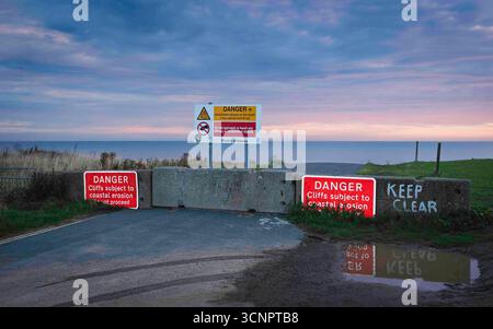 Reflective, colourful, warning signs of serious coastal and road ...